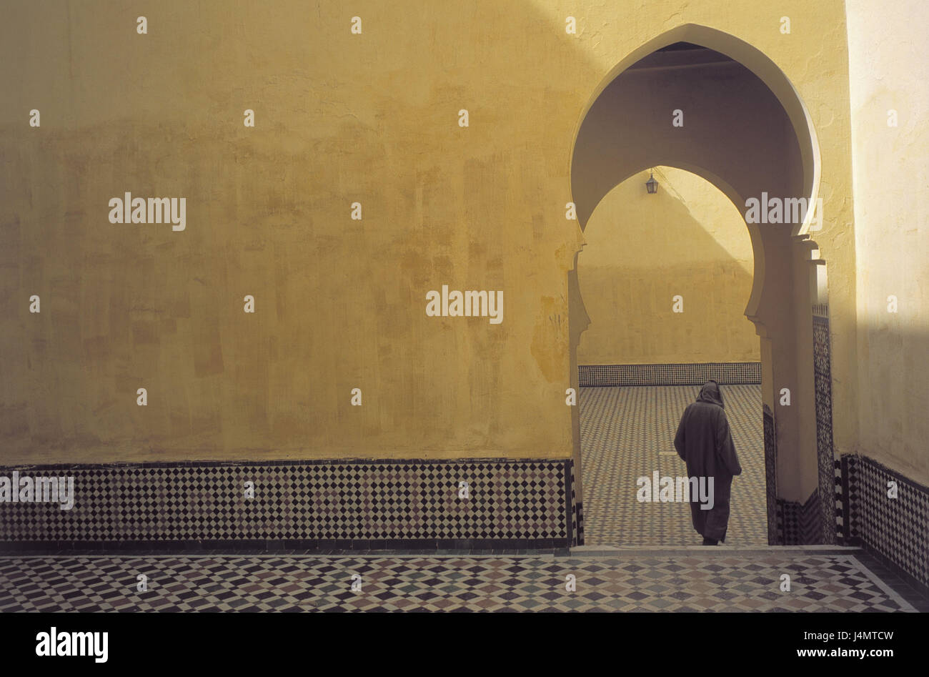 Morocco, Meknes, mausoleum Moulay Ismail, walls, yellow, archways, man ...