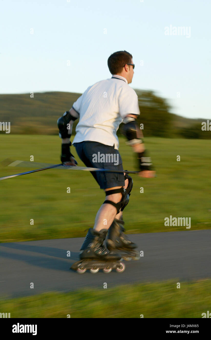 Country road, man, young, Nordic Blading, at the side, back view, blur ...