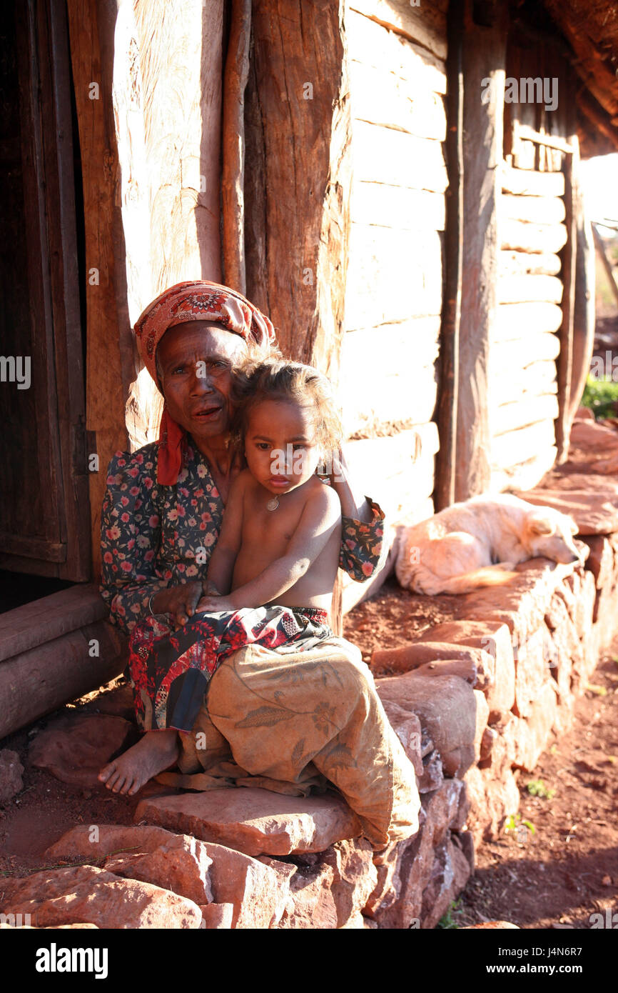 Democratic republic of Timor-Leste, poor bites, woman and child sit ...