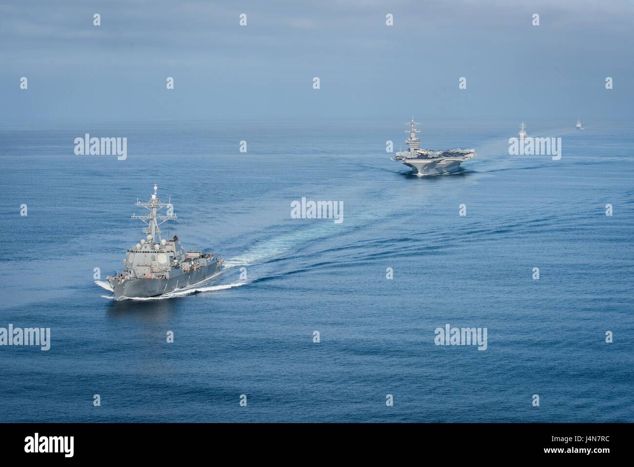 The U.S. Navy Nimitz-class nuclear aircraft carrier USS Theodore Roosevelt under escort by ...