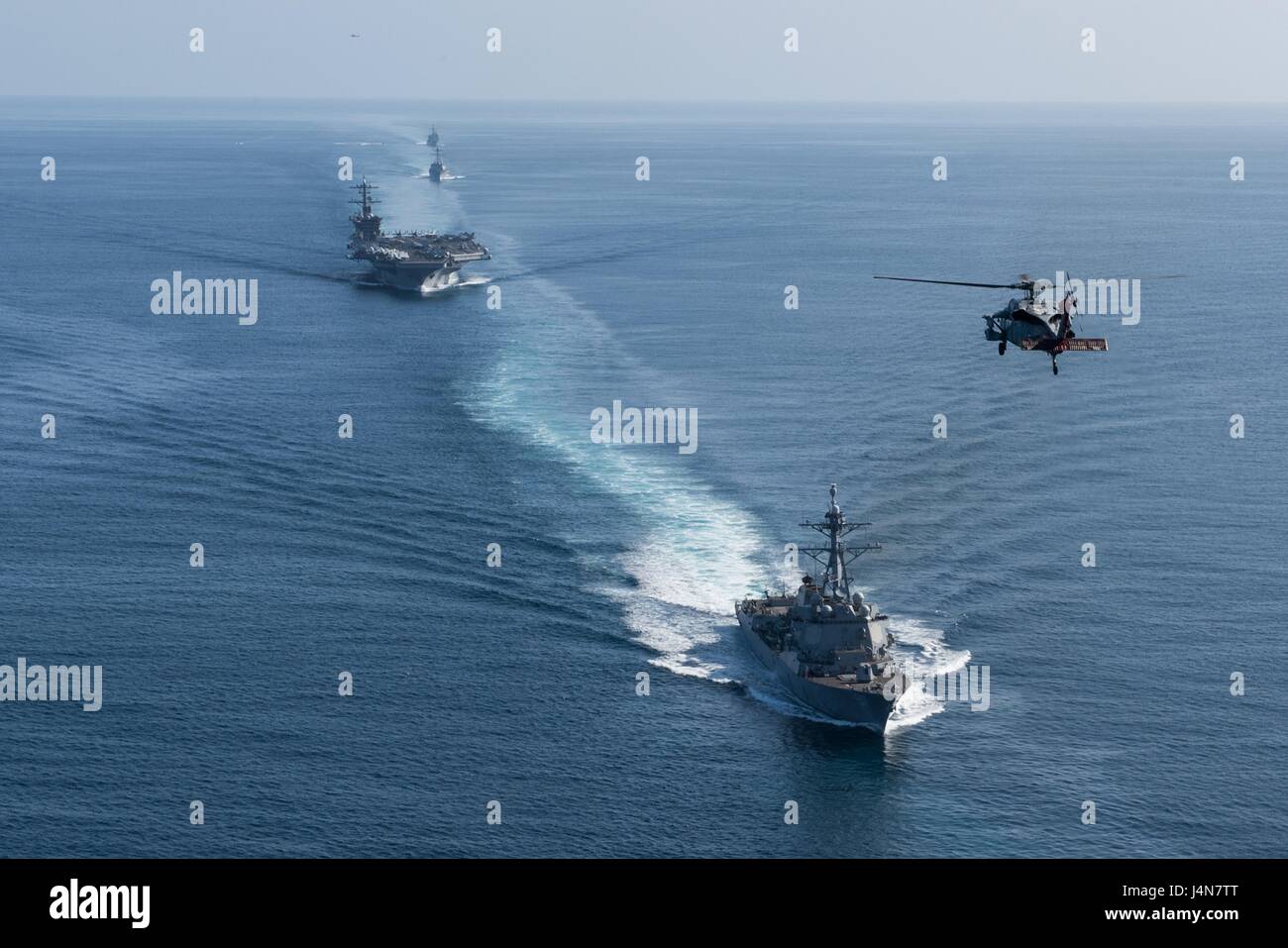 The U.S. Navy Nimitz-class nuclear aircraft carrier USS Theodore Roosevelt under escort by ...