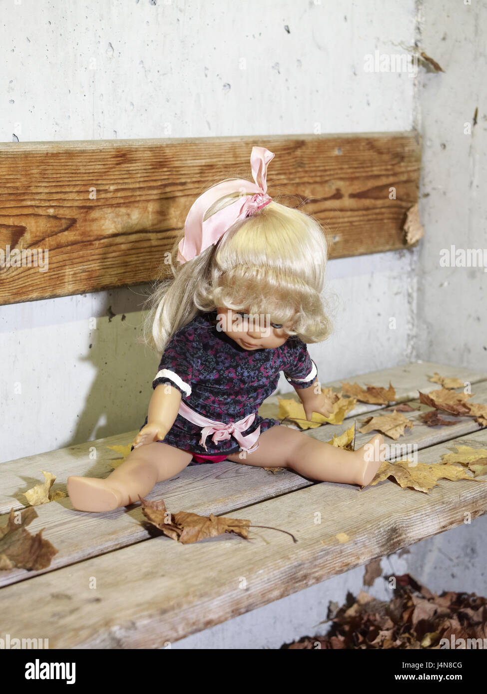 Doll, bus stop Stock Photo - Alamy