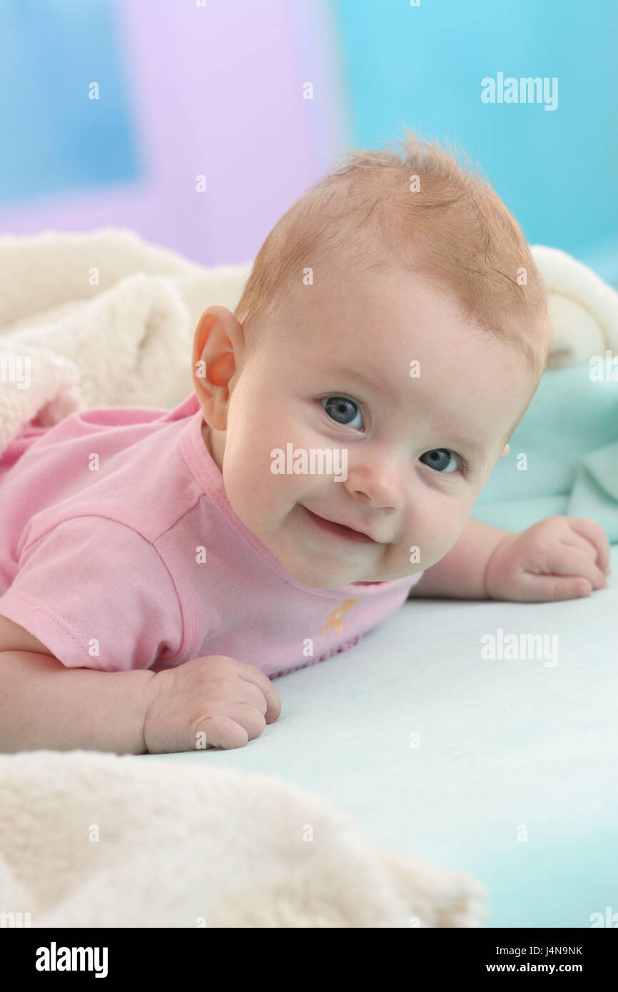Baby, 6 months, lie, smile, portrait Stock Photo - Alamy