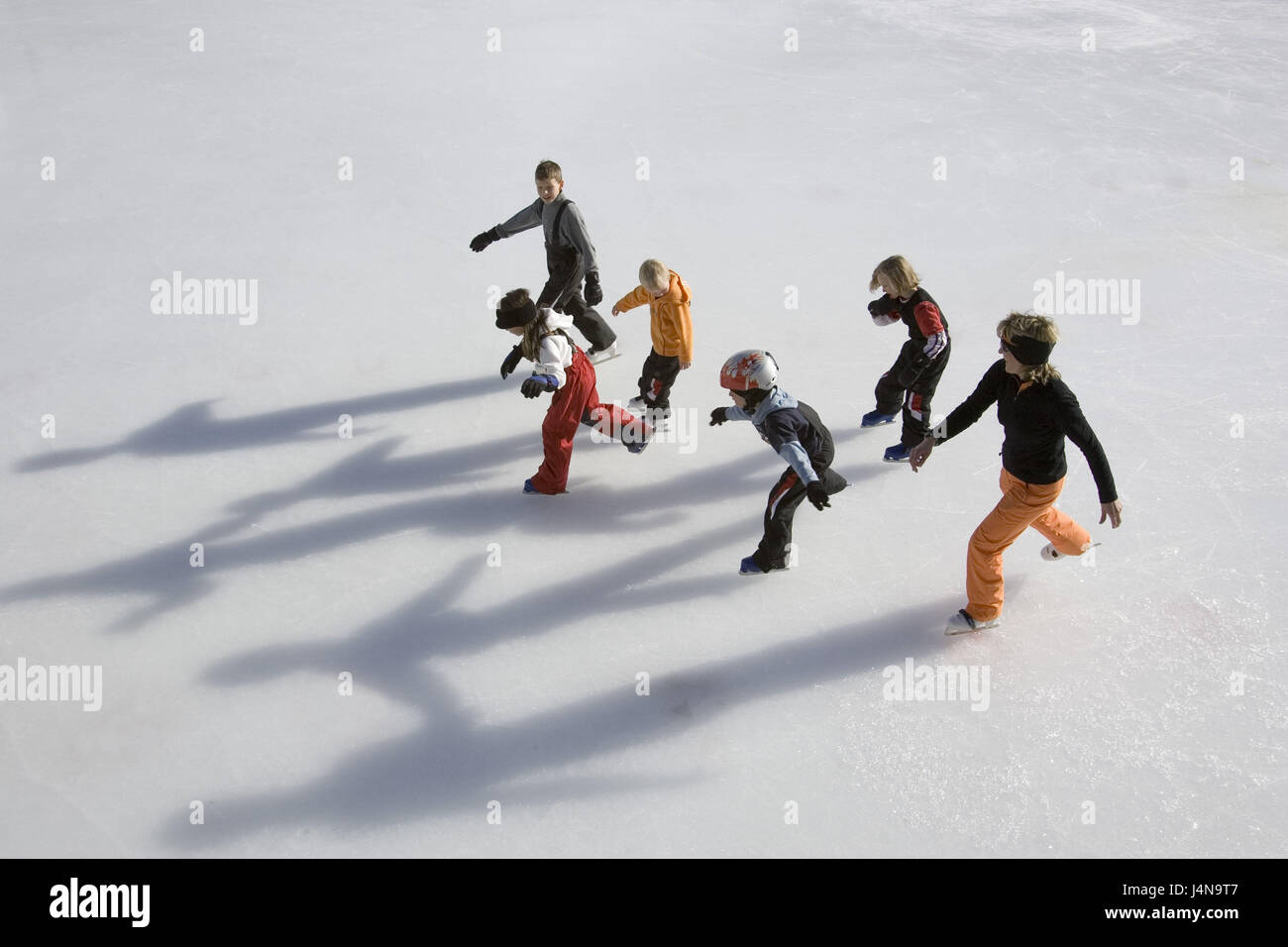 Group of children ice skating hi-res stock photography and images - Alamy