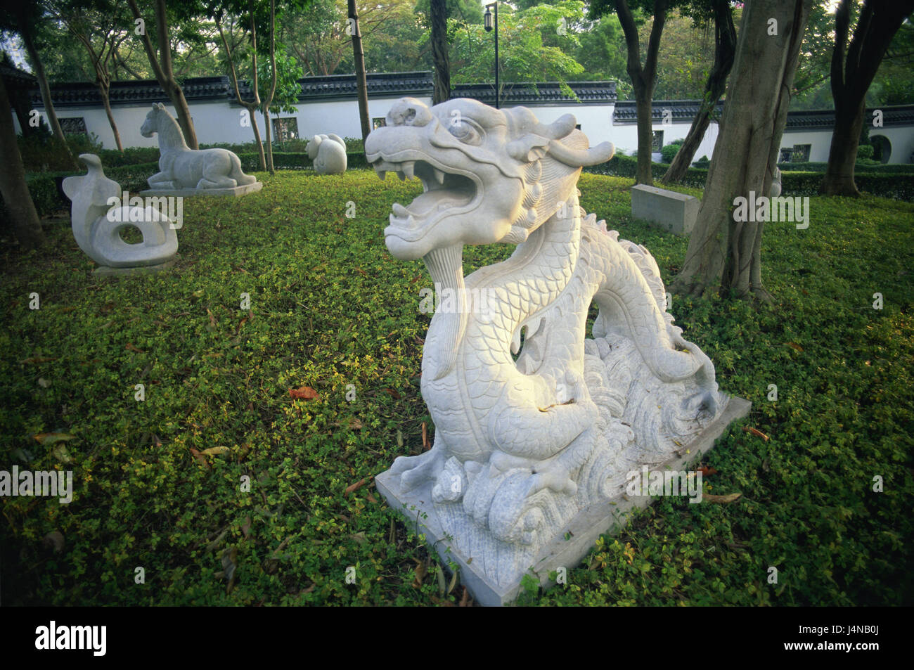 China, Hong Kong, Kowloon, Walled city park, stone sculptures, signs of ...