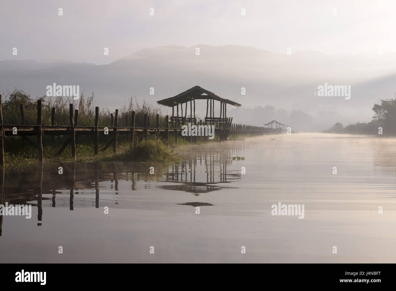 Wooden jetty, boathouse, morning light, Inle lake, Myanmar Stock Photo ...