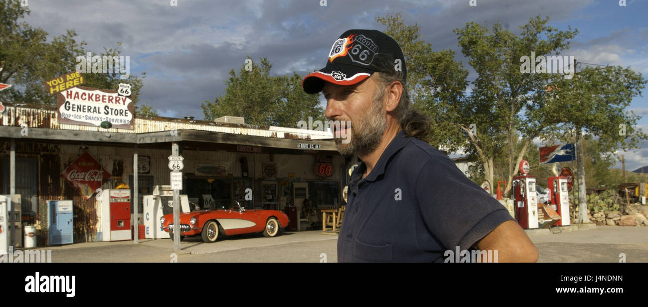 The USA, Arizona, route 66, Hackberry, filling station, man, sign cap ...