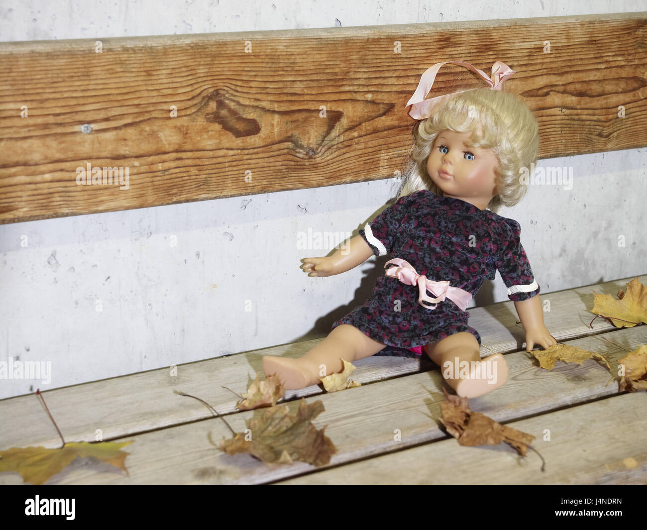 Doll, bus stop Stock Photo - Alamy
