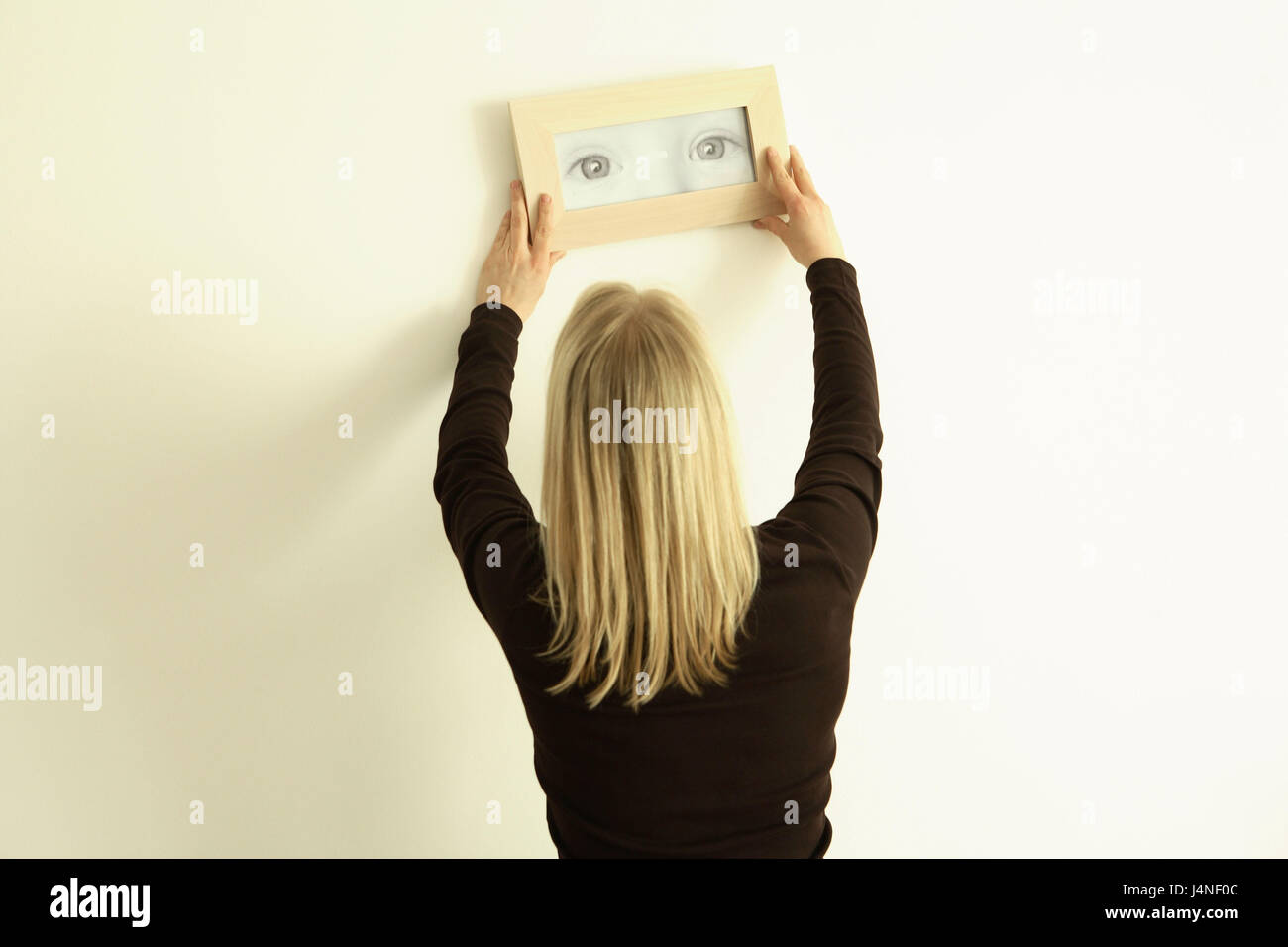 Woman, back view, picture, eyes, hang up Stock Photo - Alamy