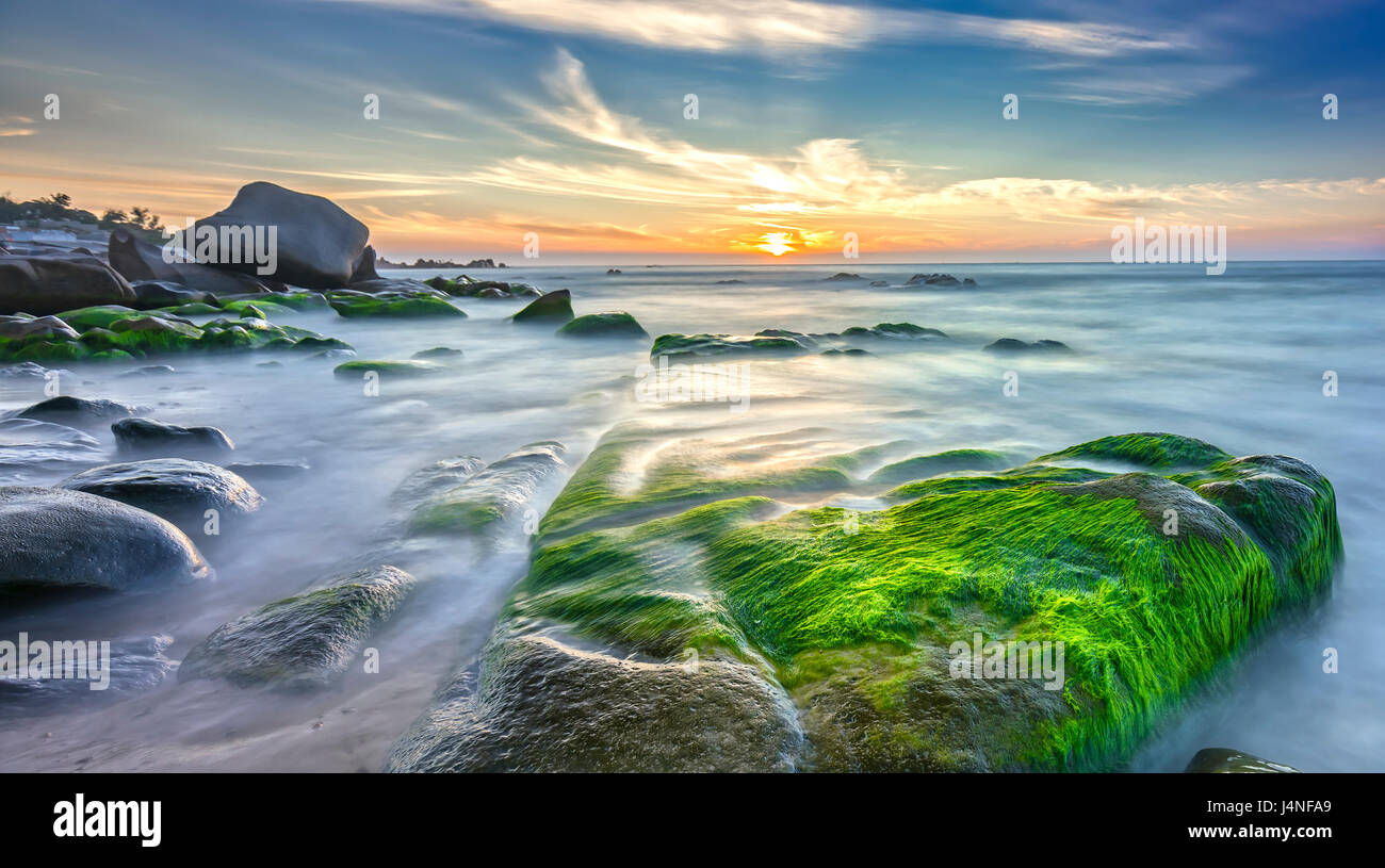Dawn on ancient rocks moss covered with colorful sky welcome beautiful ...