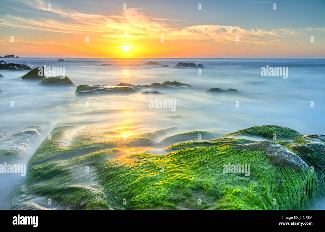 Dawn on ancient rocks moss covered with colorful sky welcome beautiful ...