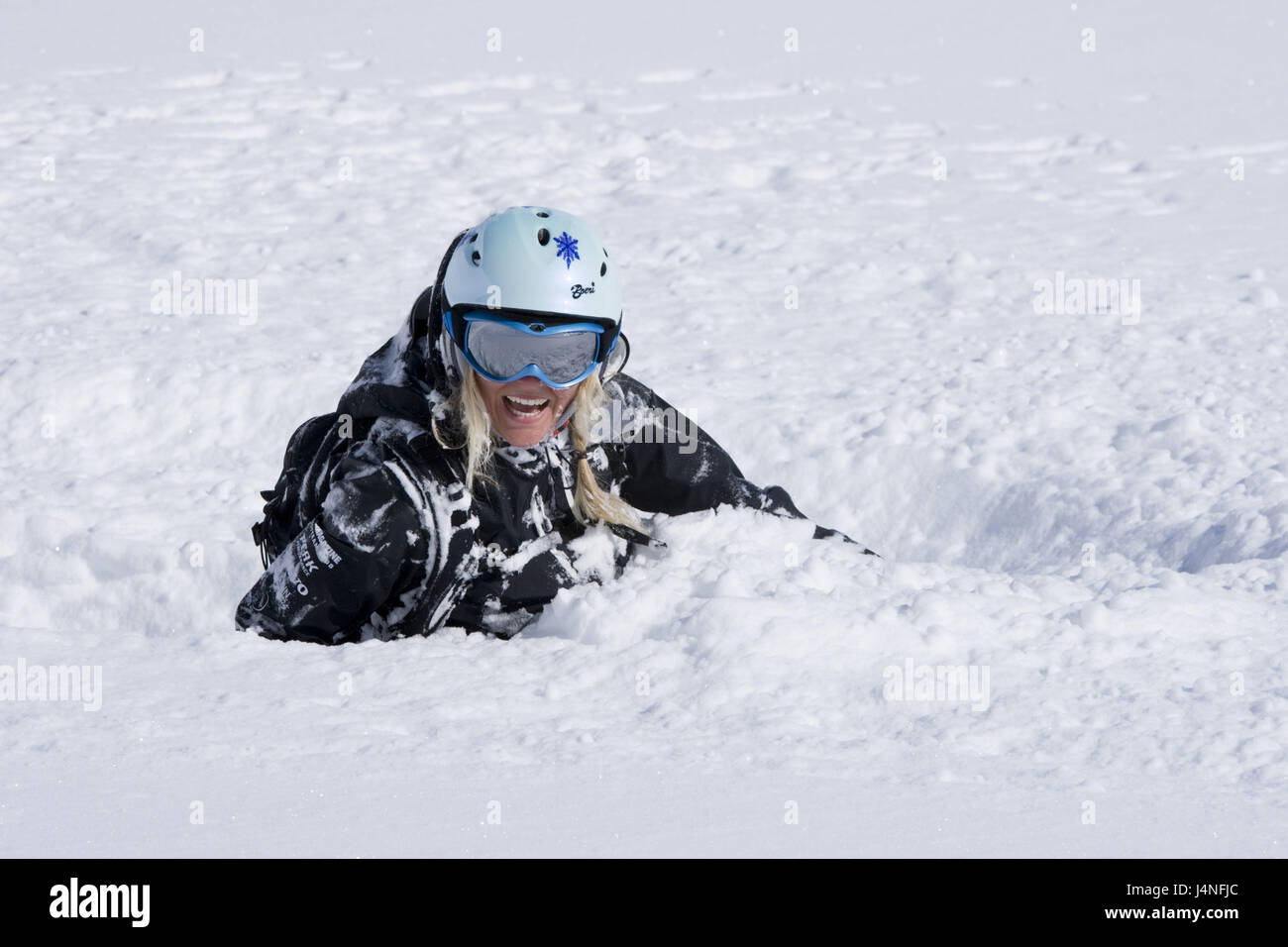 Skier, lie happily, fall, snow, model released Stock Photo - Alamy