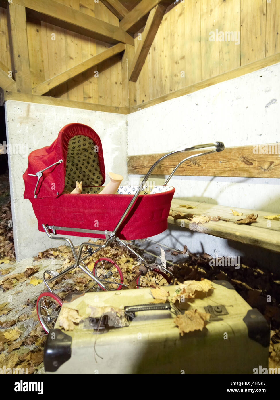 Baby carriages, doll, suitcase, bus stop, at night Stock Photo - Alamy