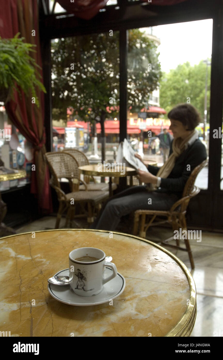 France, Paris, cafe of Le cathedrals, table, coffee cup, woman ...