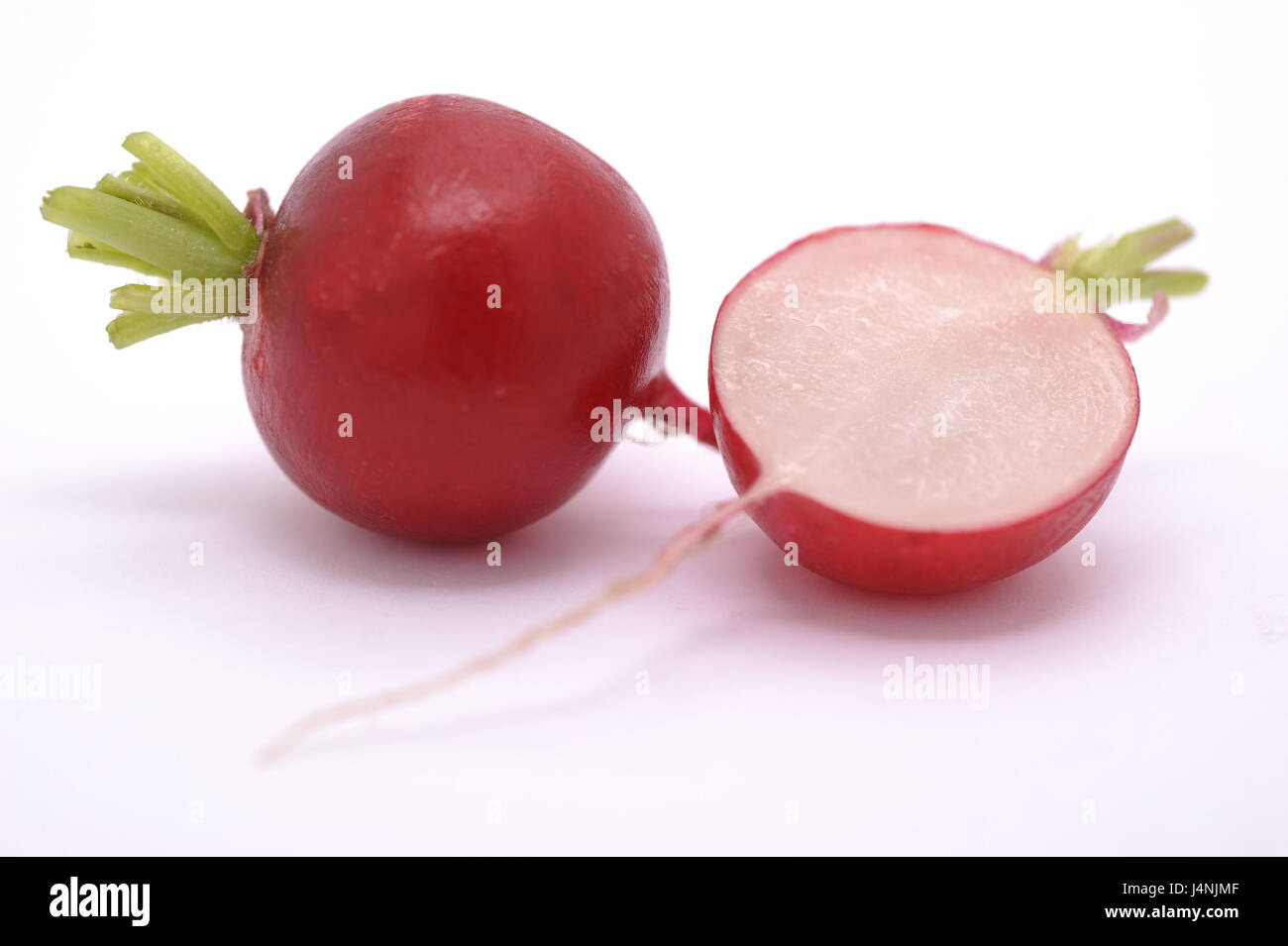 Radish, completely, halves Stock Photo - Alamy