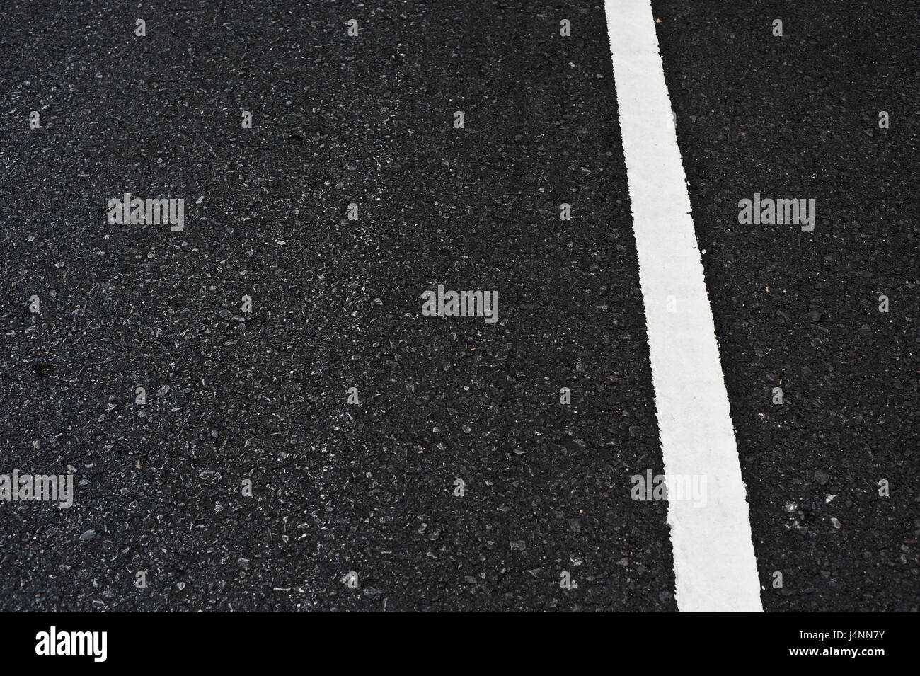Close up asphalt surface of road divide white lines Stock Photo - Alamy
