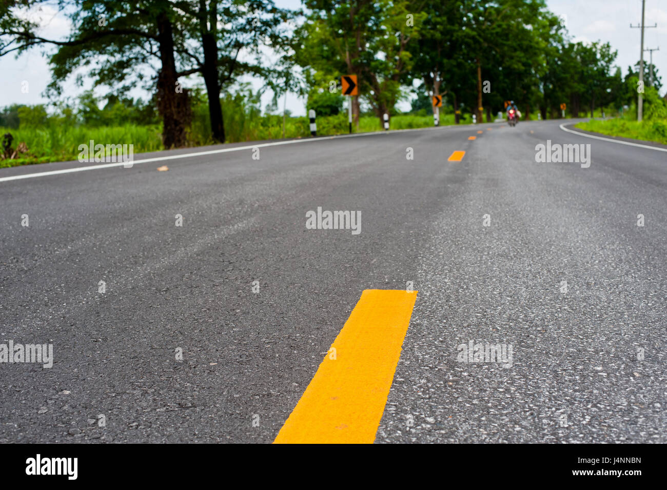 Close up asphalt surface of road divide yellow lines Stock Photo - Alamy