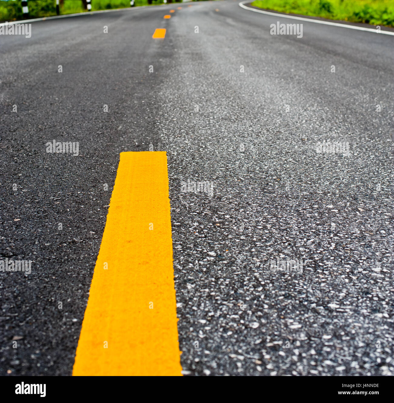 Close up asphalt surface of road divide yellow lines Stock Photo - Alamy