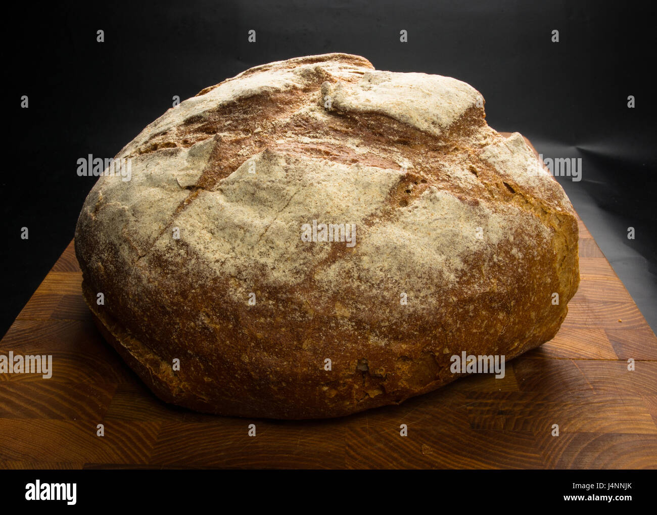 cut malt bread handmade on wooden background Stock Photo - Alamy