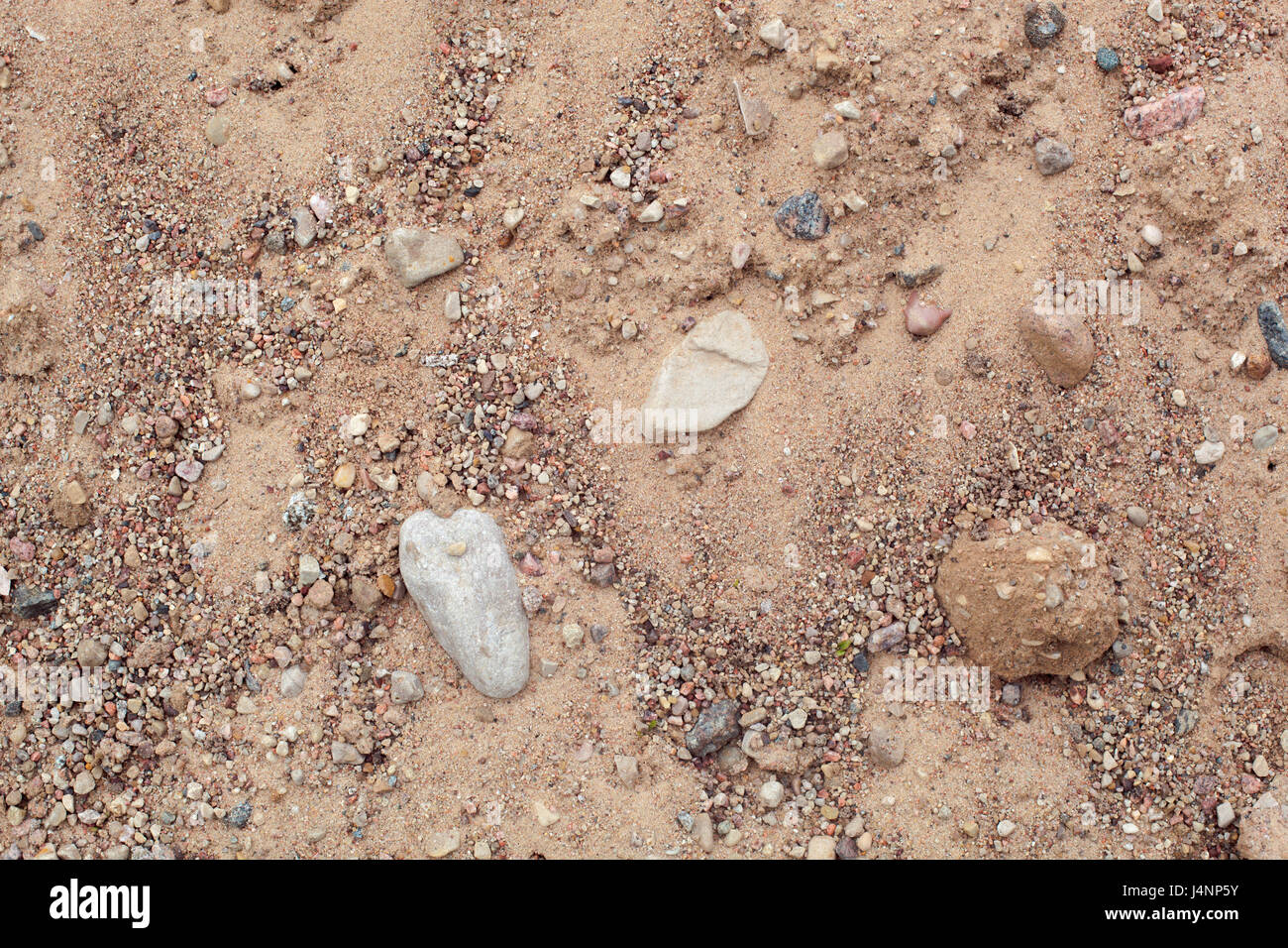 Color pebbles in the sand Stock Photo - Alamy