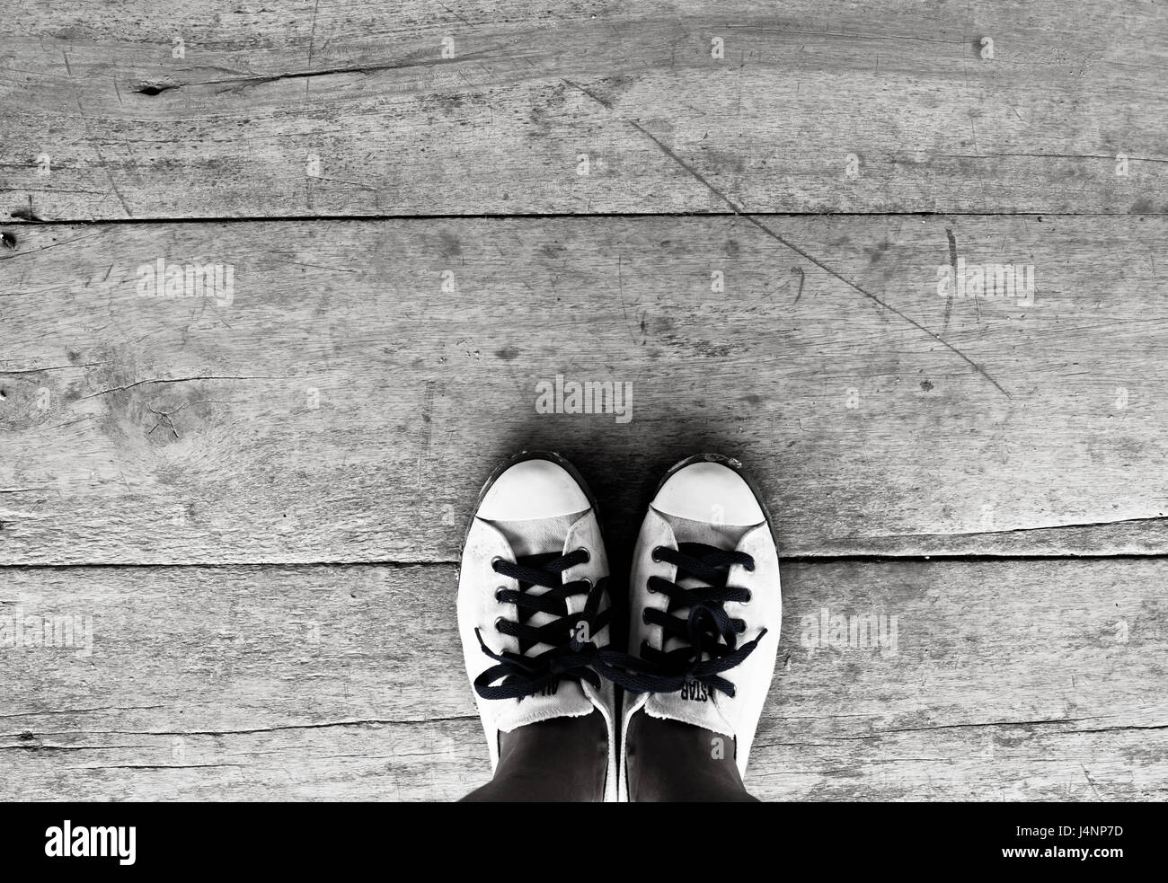 Pair of shoes standing from an aerial view on wooden background Stock ...