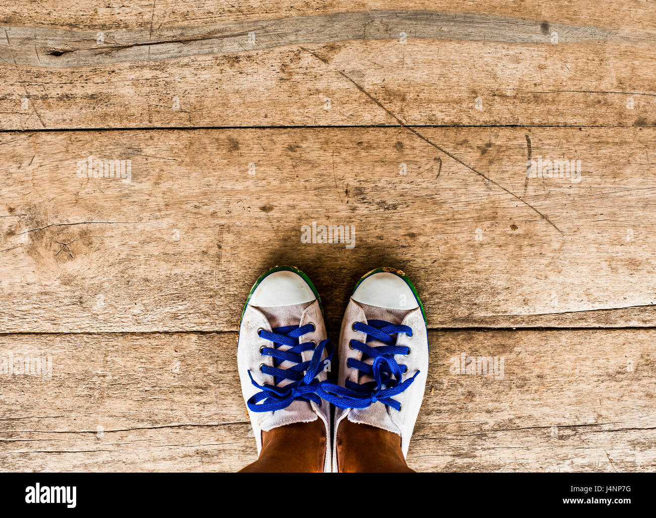 Pair of shoes standing from an aerial view on wooden background Stock ...
