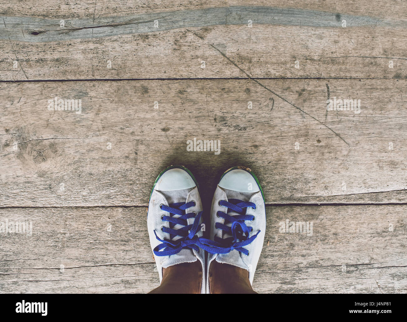 Pair of shoes standing from an aerial view on wooden background Stock ...