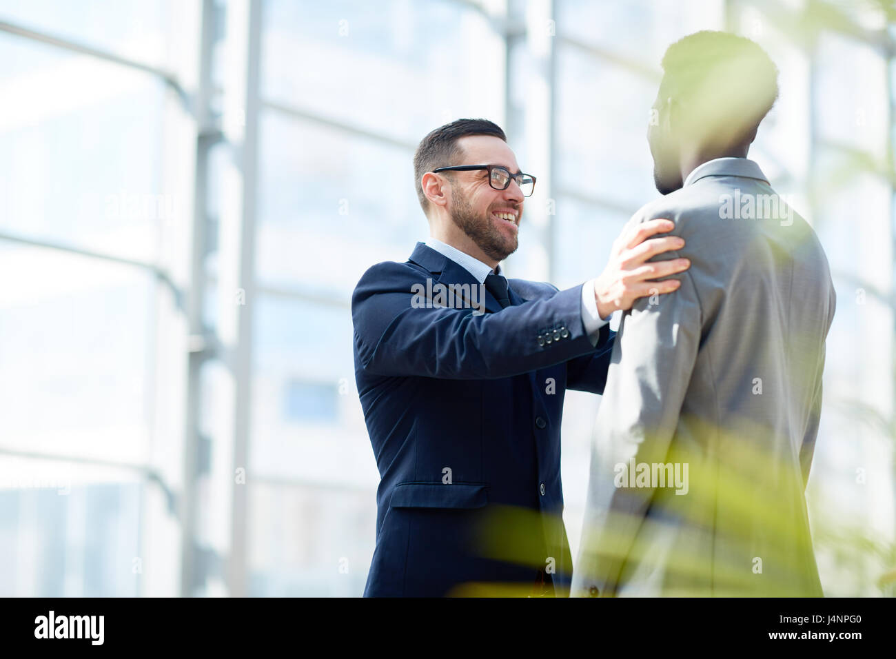 Patting shoulder hi-res stock photography and images - Alamy