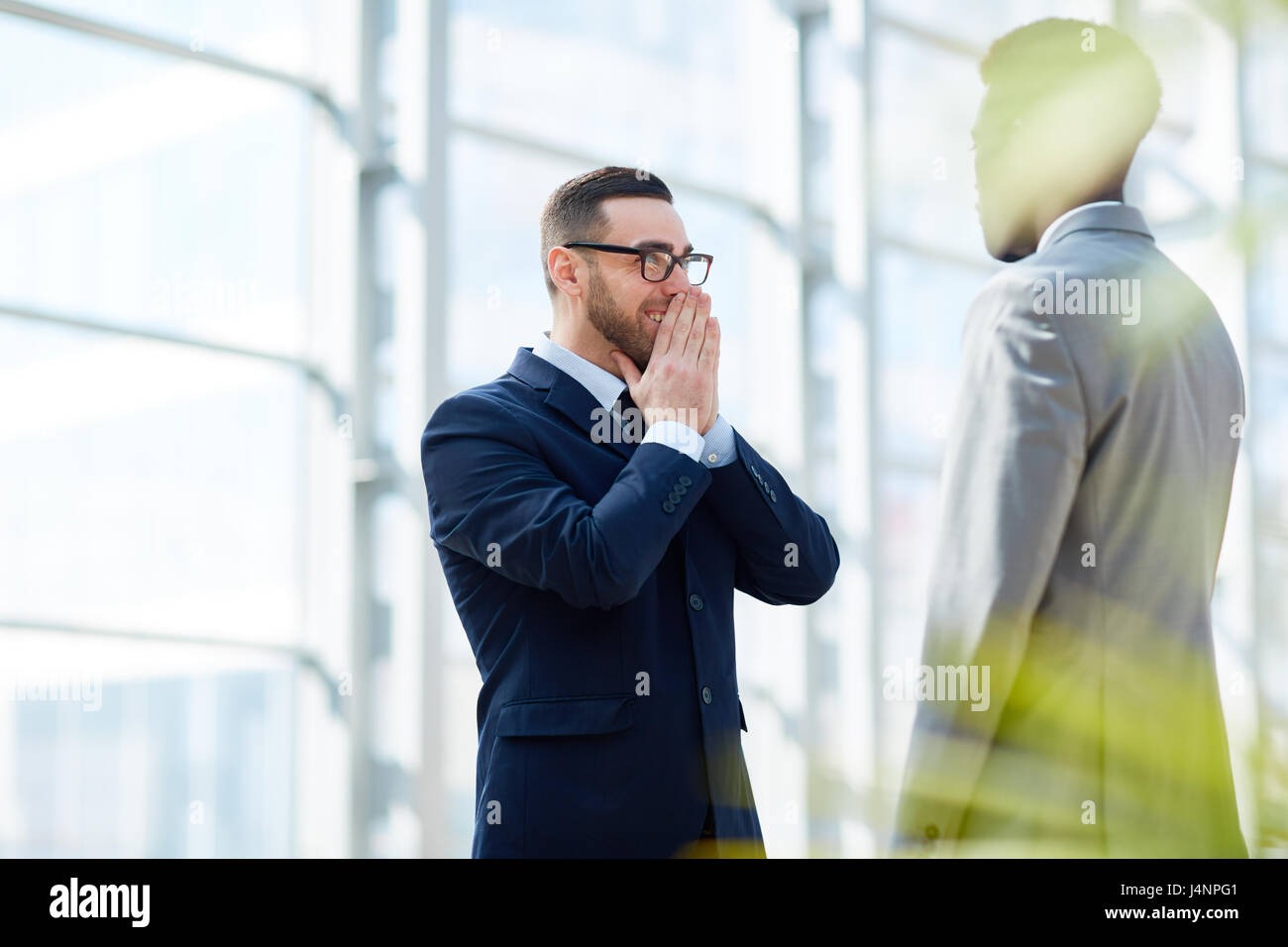 Portrait of successful businesman smiling with happiness while talking ...