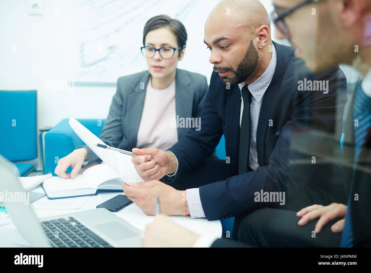 Sales manager explaining points of contract to potential partner Stock ...