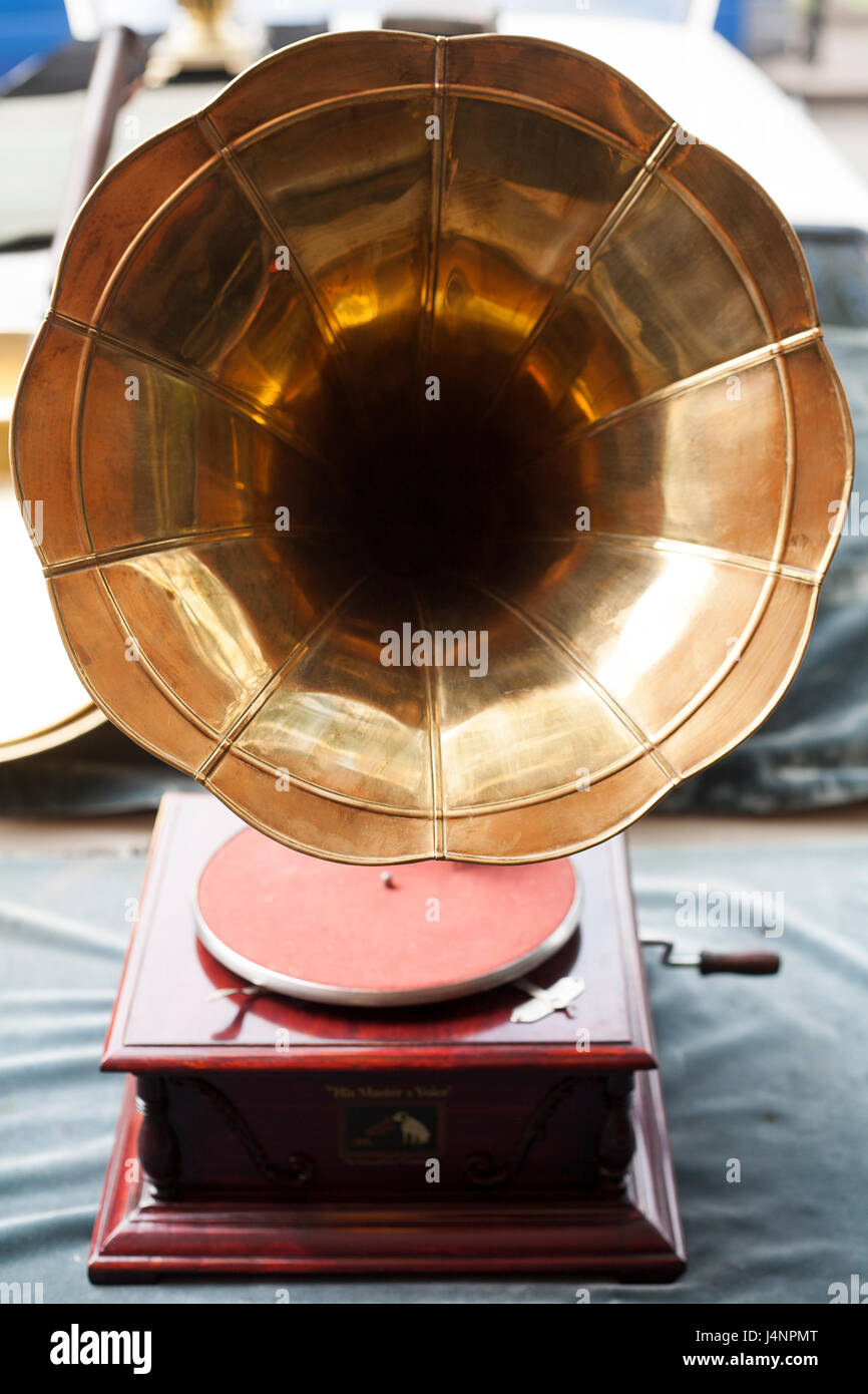 An old fashioned phonograph or record player with a horn speaker at at ...