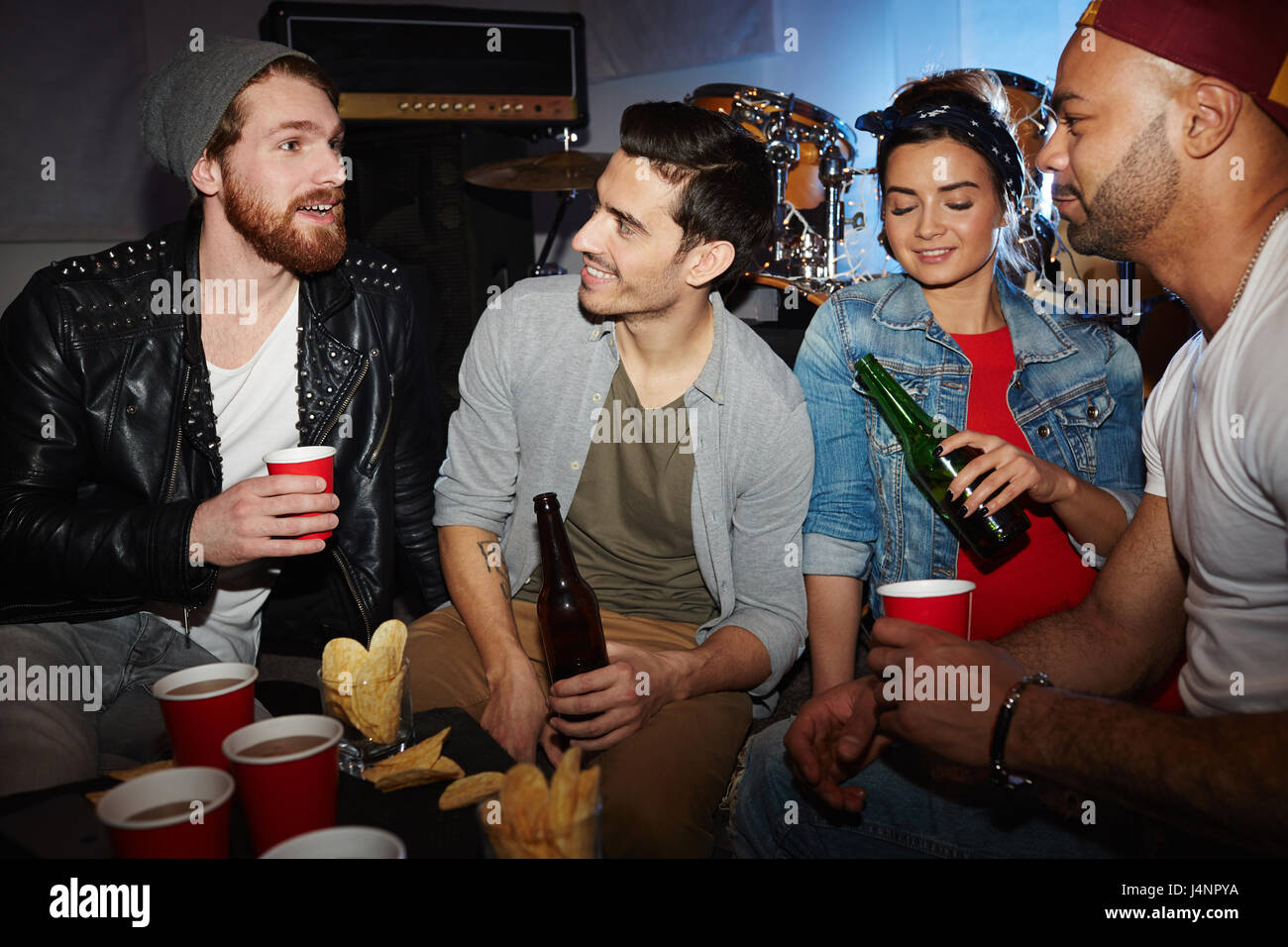 Group of modern young people enjoying party in small night club ...