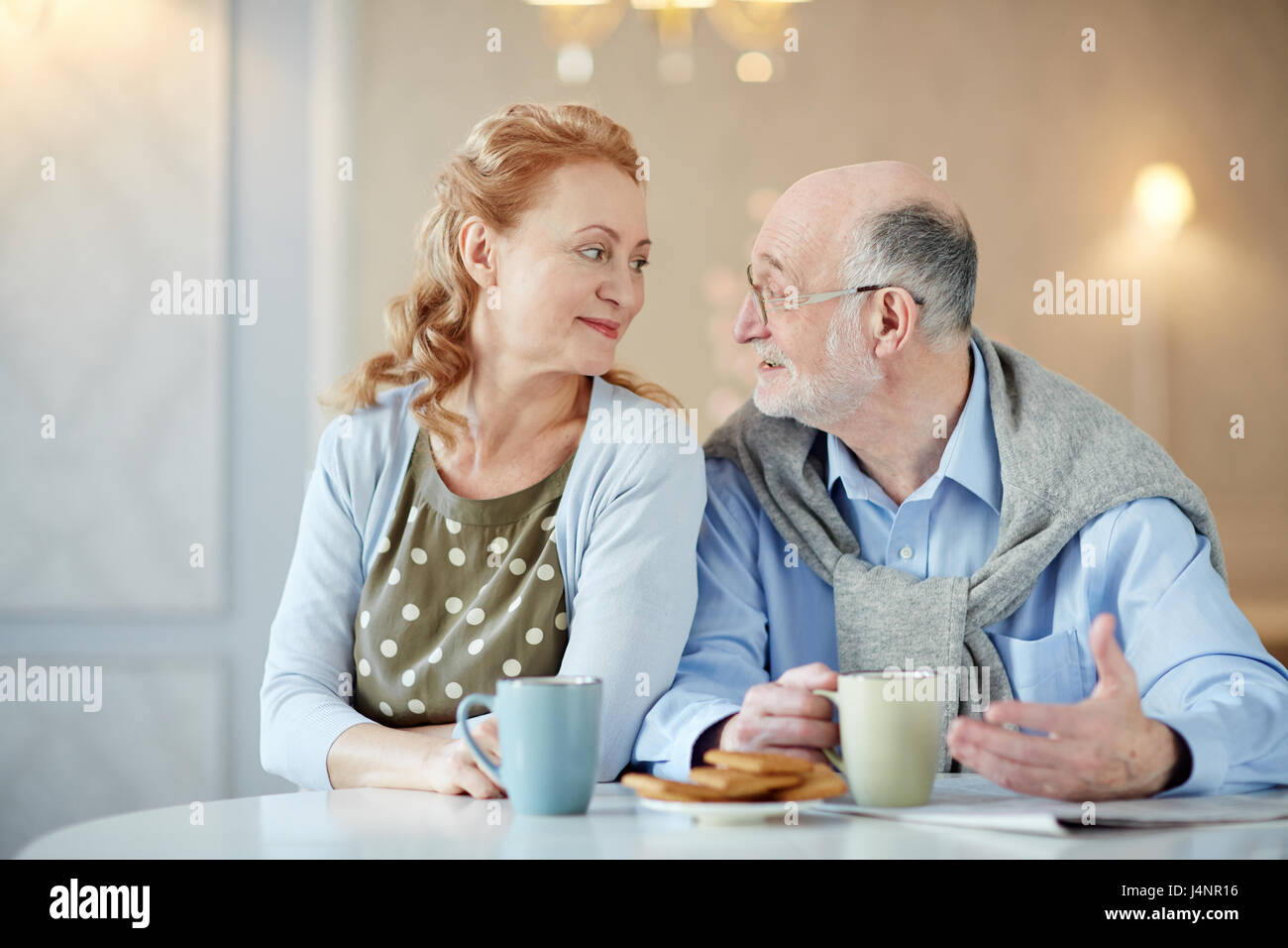 Aged husband tea listening wife hi-res stock photography and images - Alamy