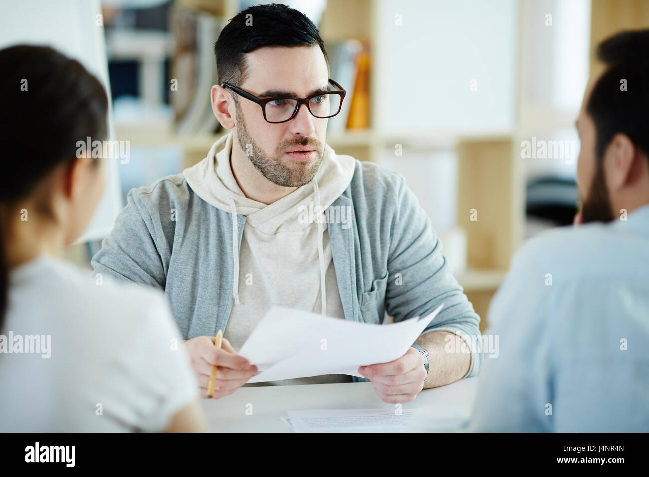 Confident man answering questions of employers during interview Stock ...