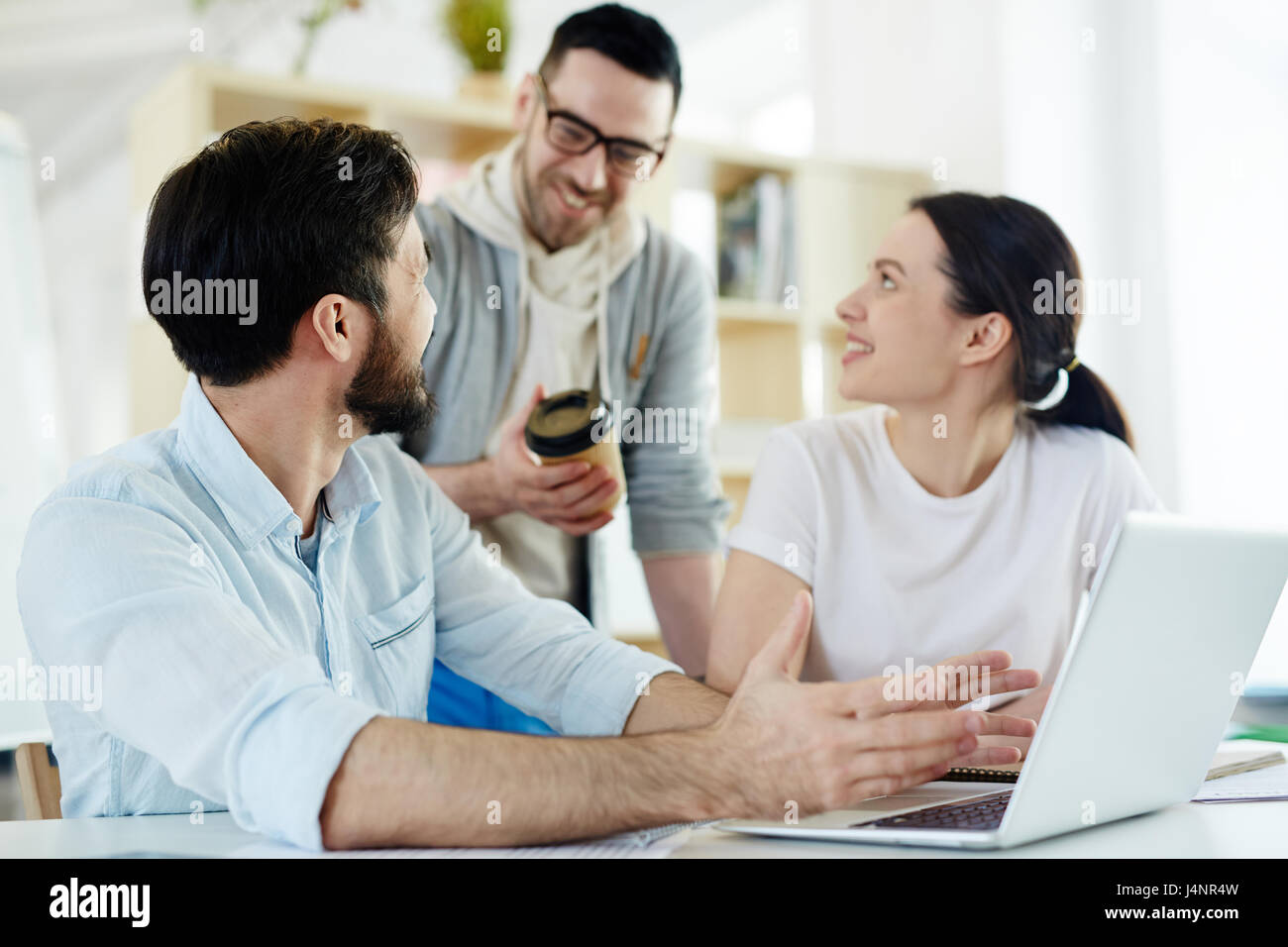 Group of happy managers having discussion of project Stock Photo - Alamy