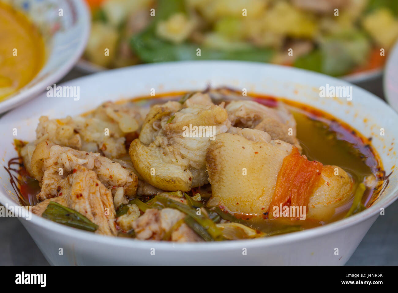 Hot and spicy soup pork cartilage with Thai herb Stock Photo - Alamy