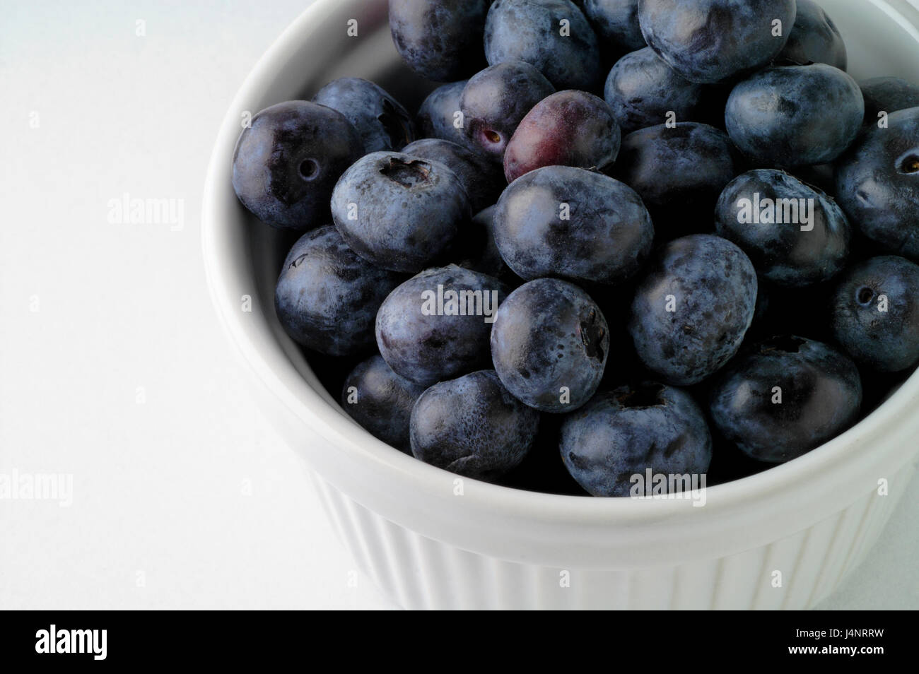 Blueberries in a cup Stock Photo - Alamy