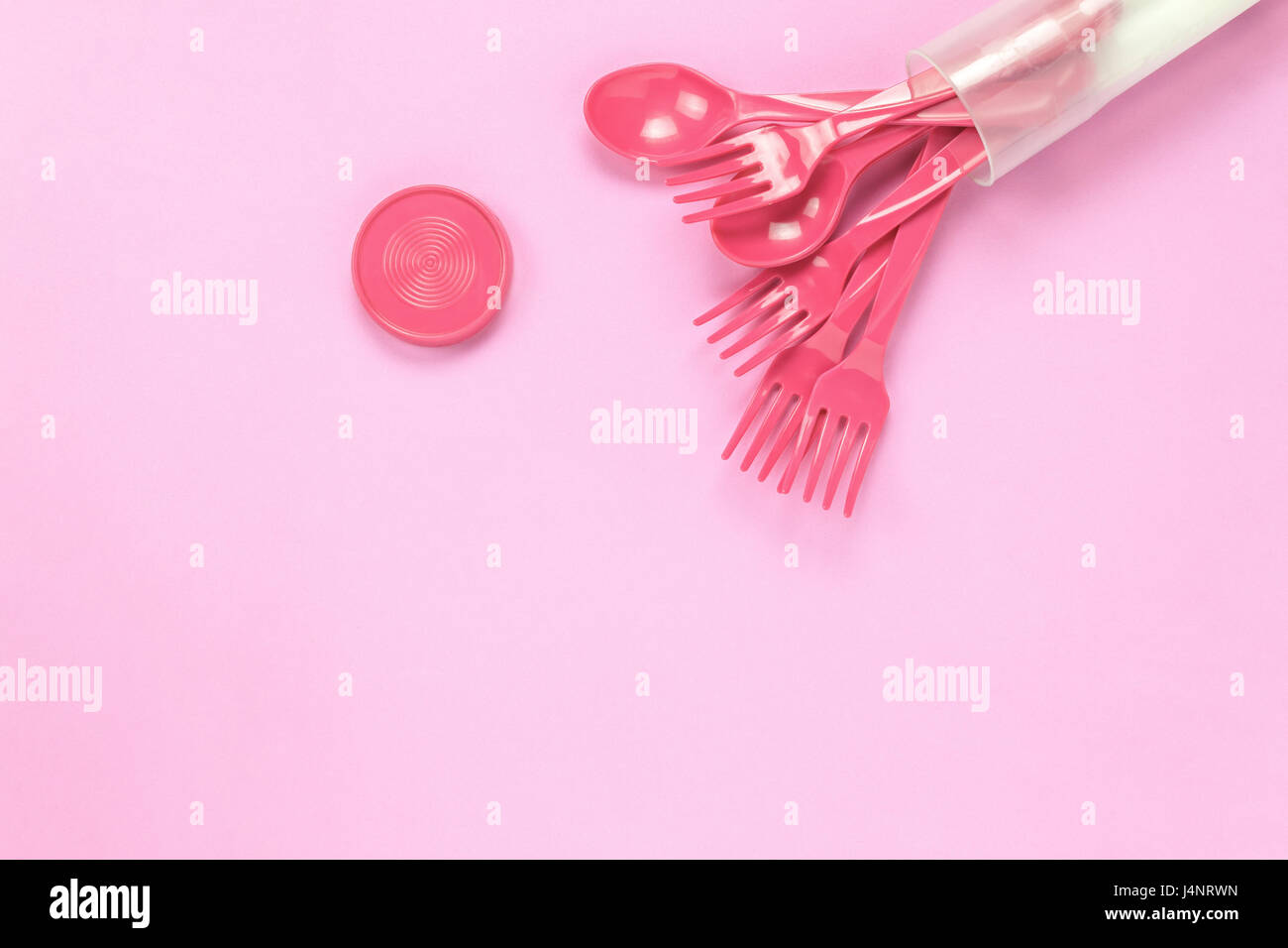 Top view colorful plastic spoon on pink table background with copy ...