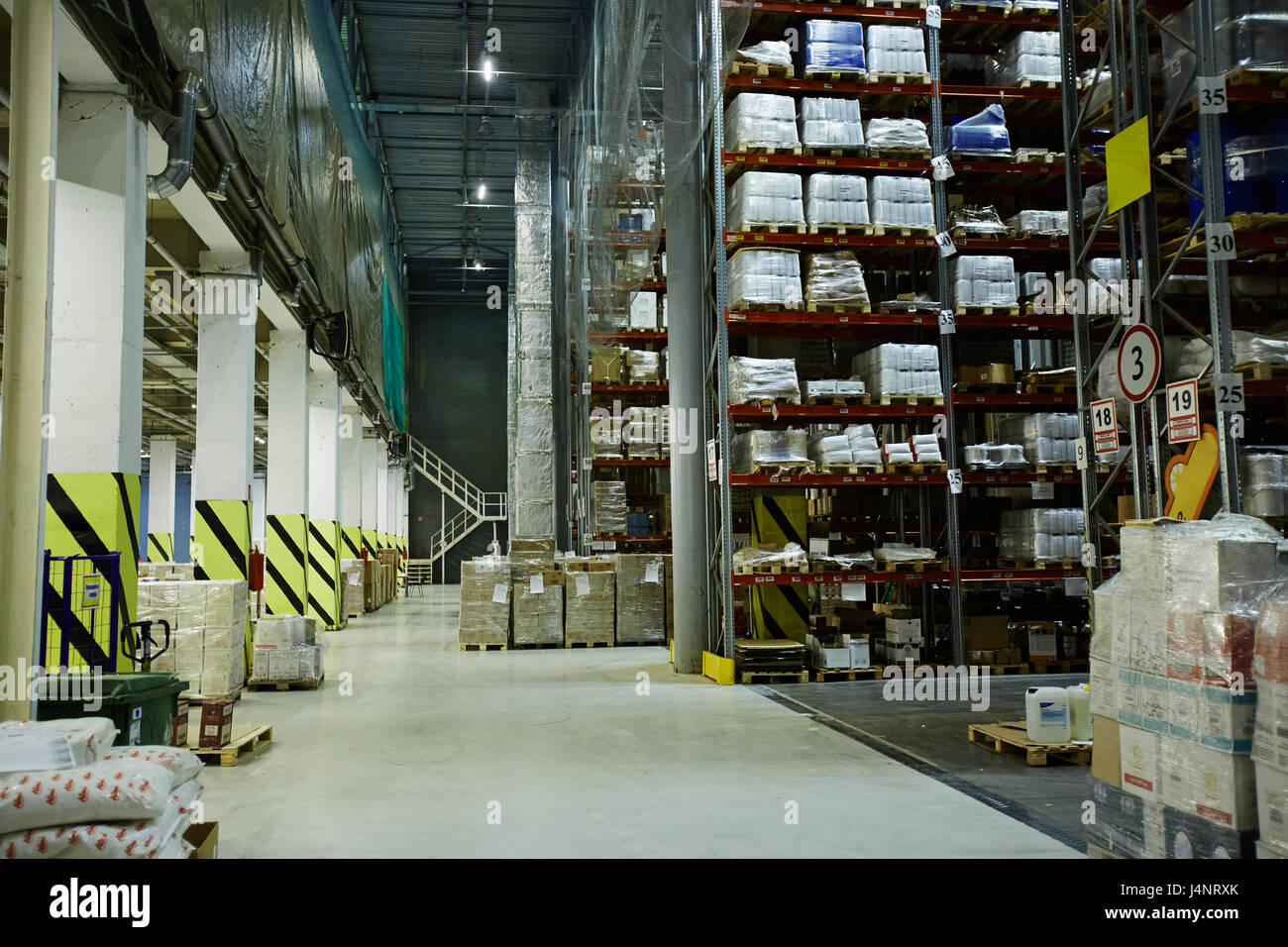 Racks with packed goods in modern warehouse Stock Photo - Alamy