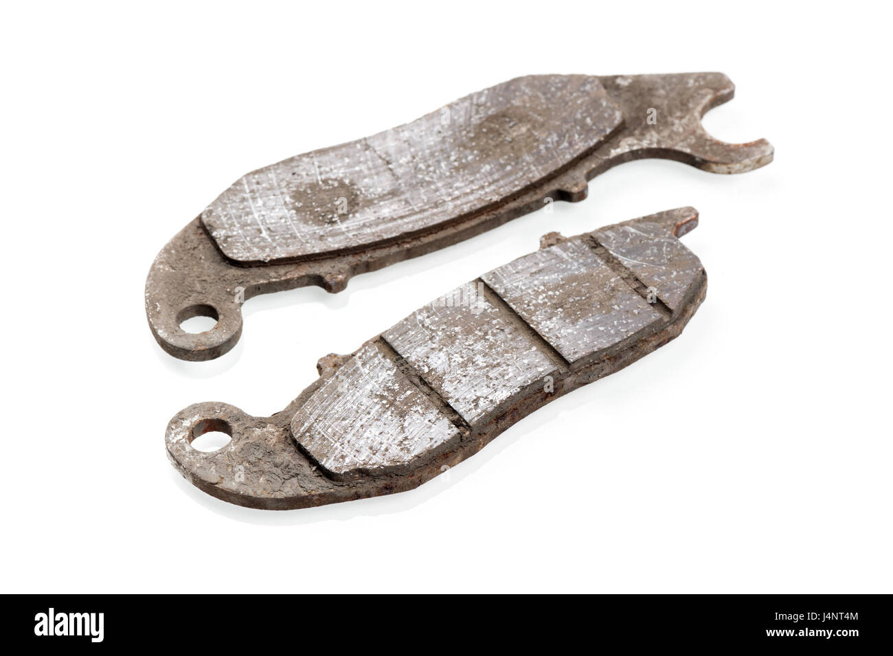 worn motorcycle disc break pads on white background Stock Photo - Alamy