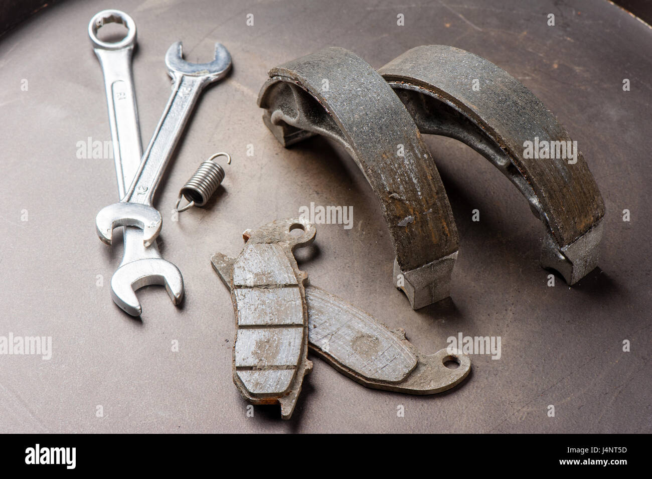 worn motorcycle break pads and break shoes Stock Photo - Alamy
