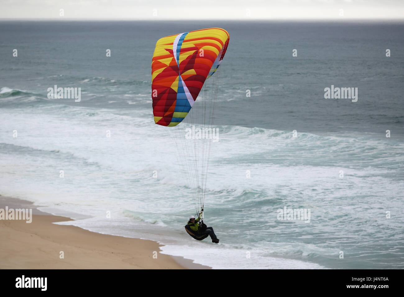 A female paragliding pilot flying at Aberta Nova beach Stock Photo - Alamy