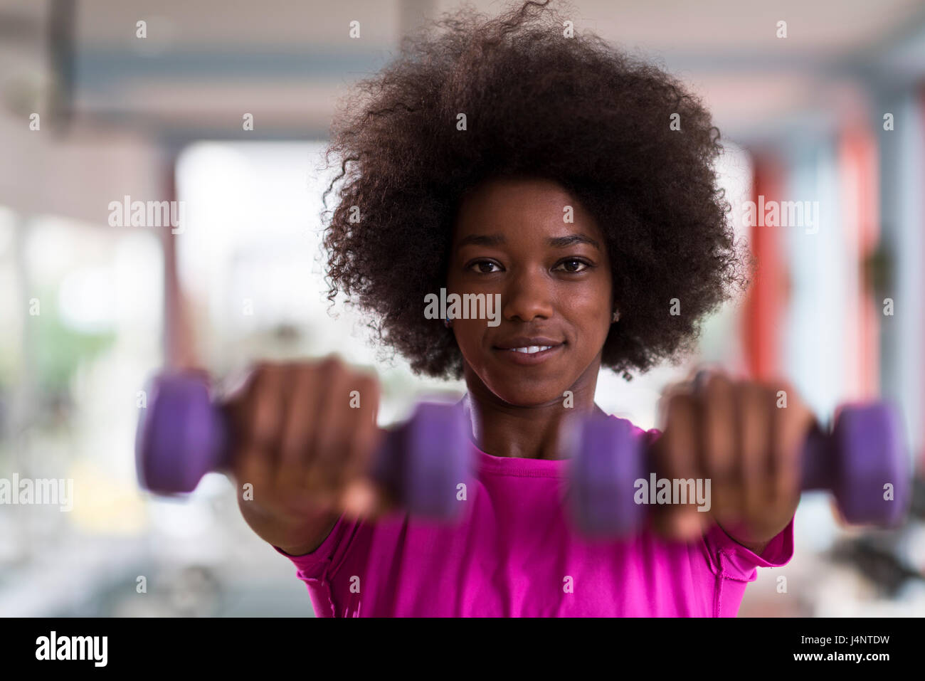 happy healthy african american woman working out in a crossfit gym on ...