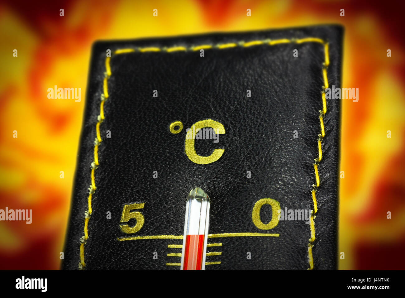 Thermometer fifty celsius, with fire background Stock Photo - Alamy