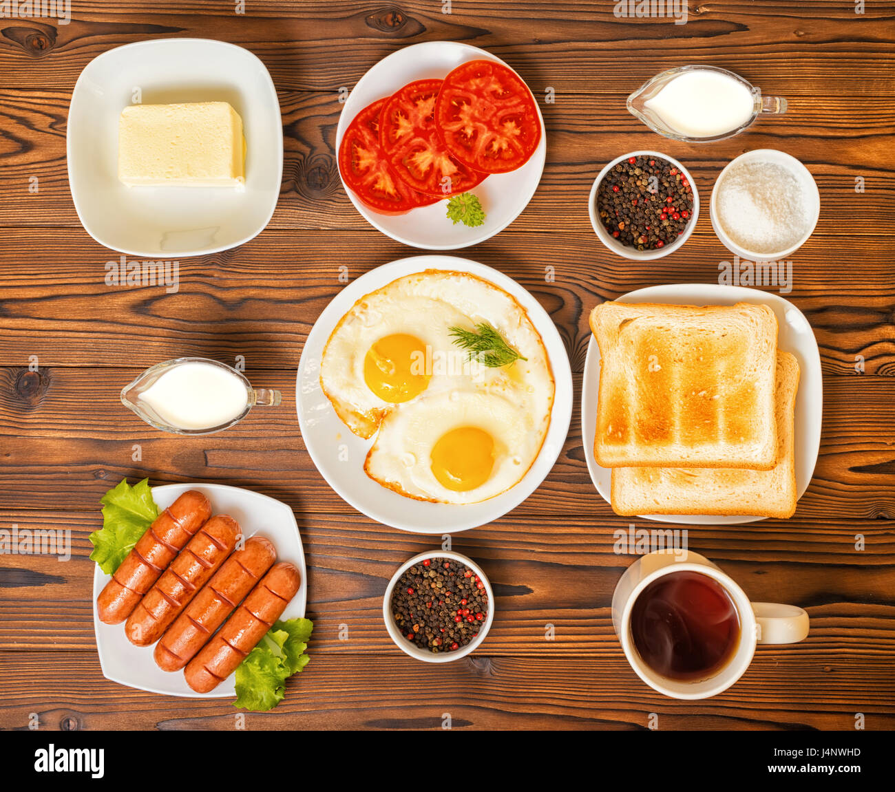 concept of morning breakfast with setting food products over wooden ...