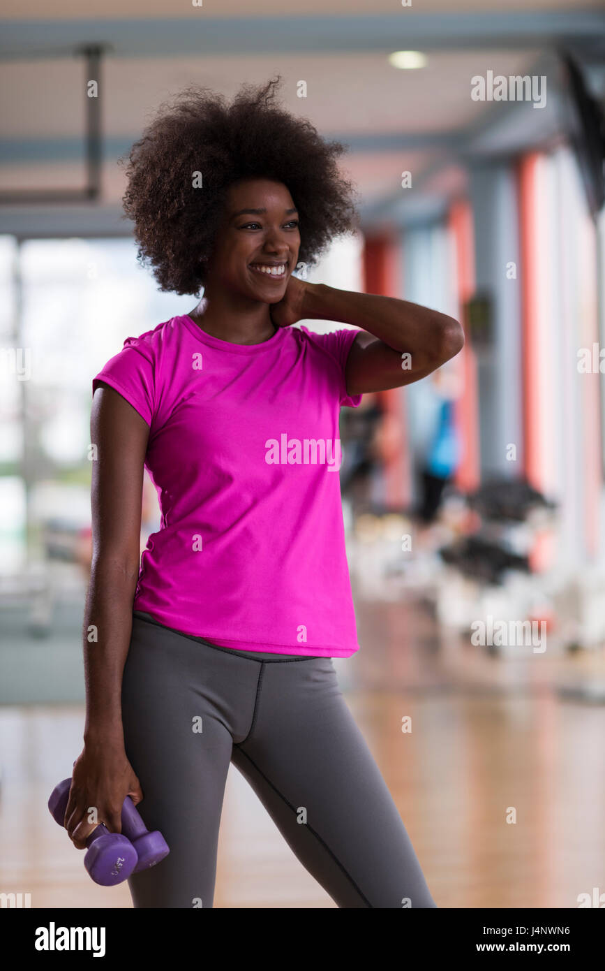 happy healthy african american woman working out in a crossfit gym on ...