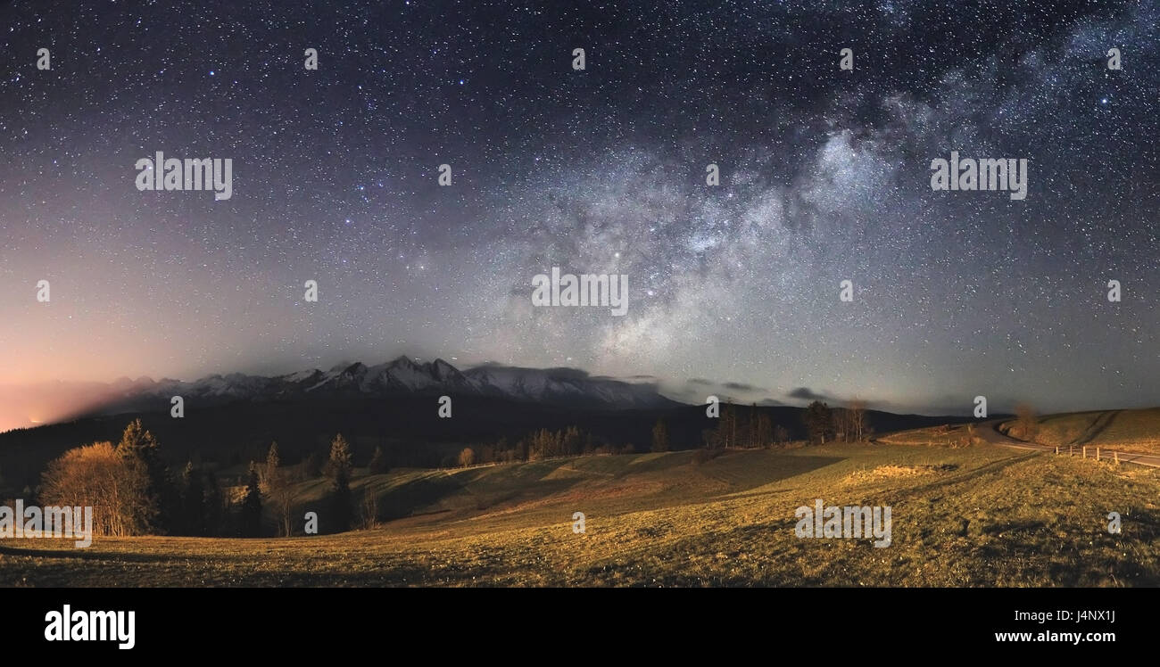 Starry sky over mountains. Bright milky way above mountains. Gorgeous ...