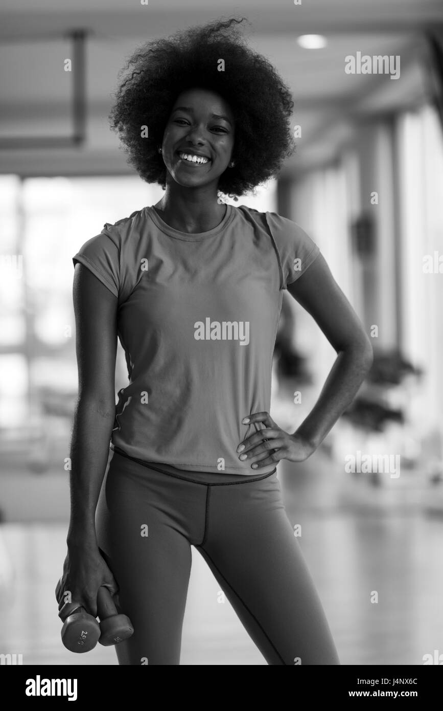 happy healthy african american woman working out in a crossfit gym on ...
