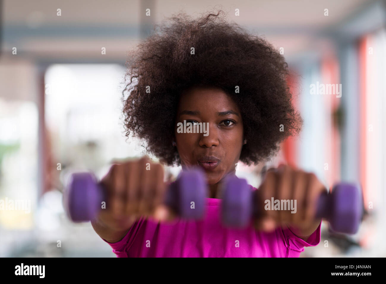 happy healthy african american woman working out in a crossfit gym on ...