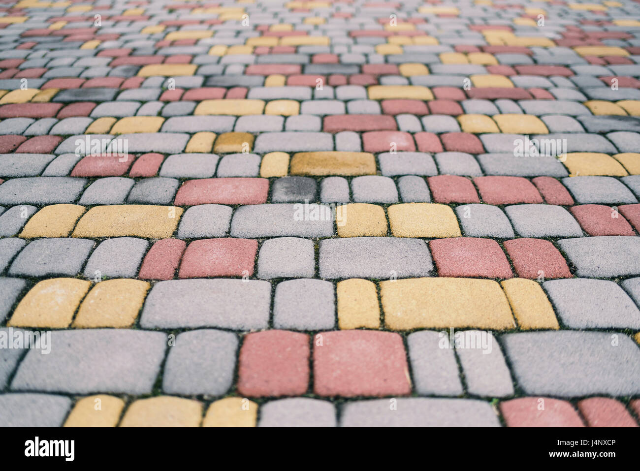 Walkway near a private house lined with colored pavement, detail Stock ...